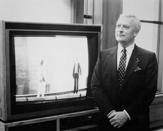 Edward Woodward as Robert McCall standing by TV set The Equalizer TV ...