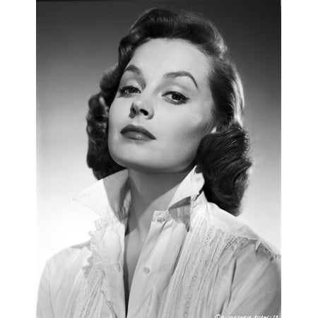 Victoria Shaw posed wearing a white, front ruffled pleated, button down ...