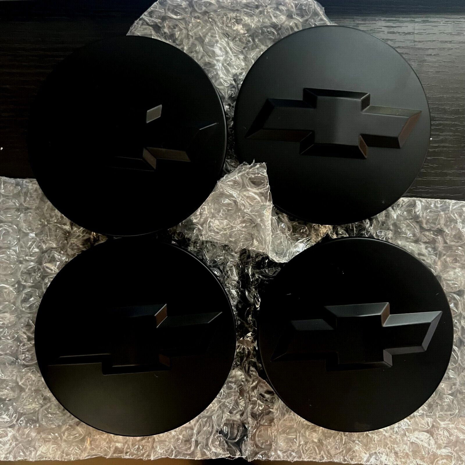 Click here for Nipocaio 4 Matte Black Rim Center Caps For Chevy S... prices