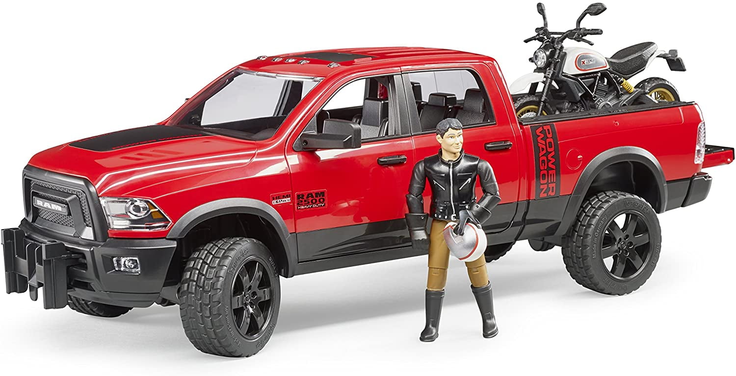 RAM 2500 Power Wagon with Scrambler Ducati Desert Sled and driver ...