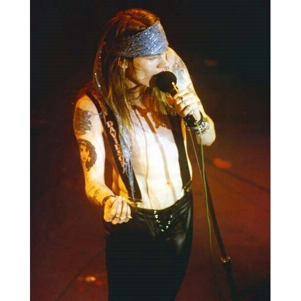 Guns N'Roses front man Axl Rose on stage holding microphone 1980's ...