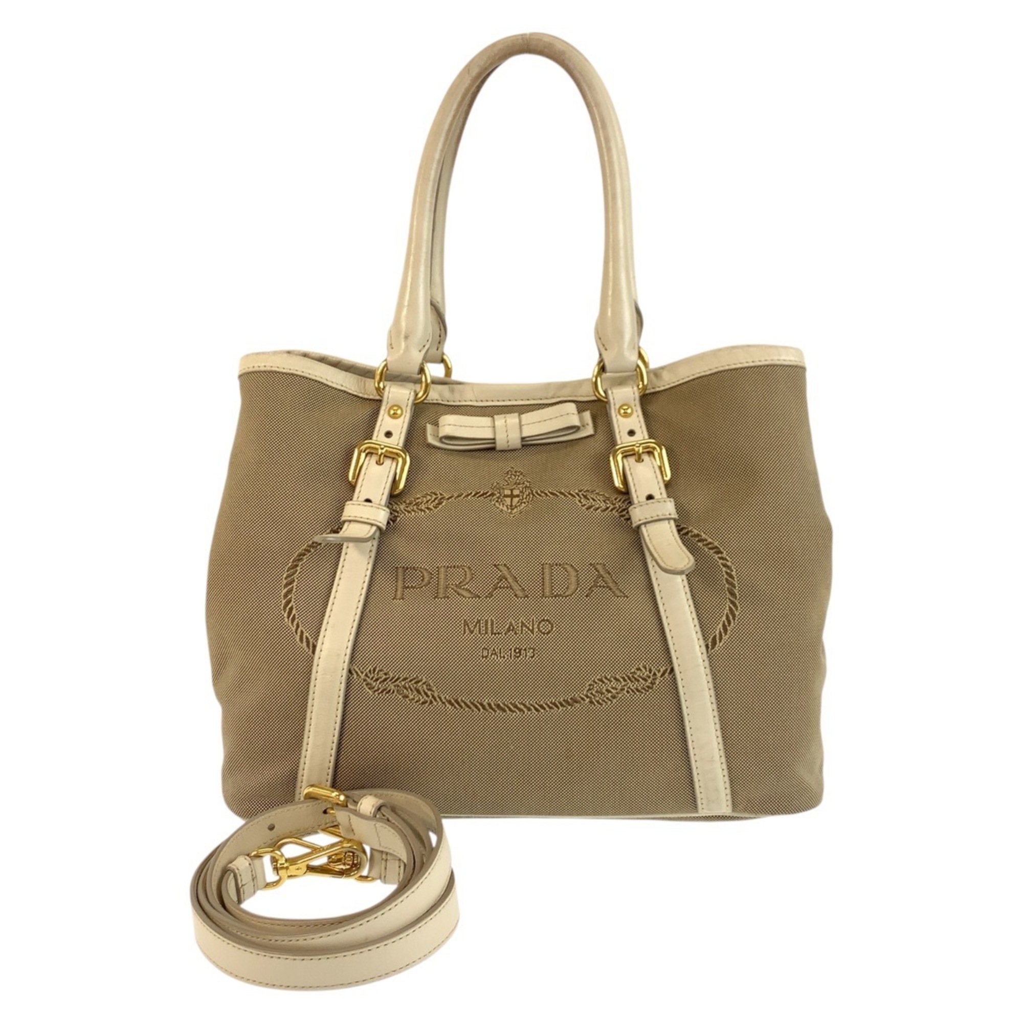 Pre-Owned PRADA Prada logo jacquard beige gold hardware canvas leather ...