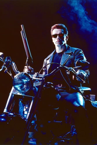 Arnold Schwarzenegger sitting on Harley Fat Boy with shotgun Terminator ...