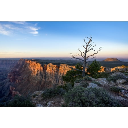 An extinct volcano near the edge of the Grand Canyon at sunset and a ...