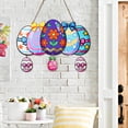A Festive Wooden Hanging Sign Featuring Vibrant Graphics And String ...