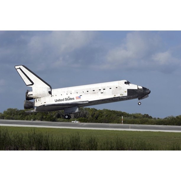 Space shuttle Discovery lands Runway 33 at the Shuttle Landing Facility ...