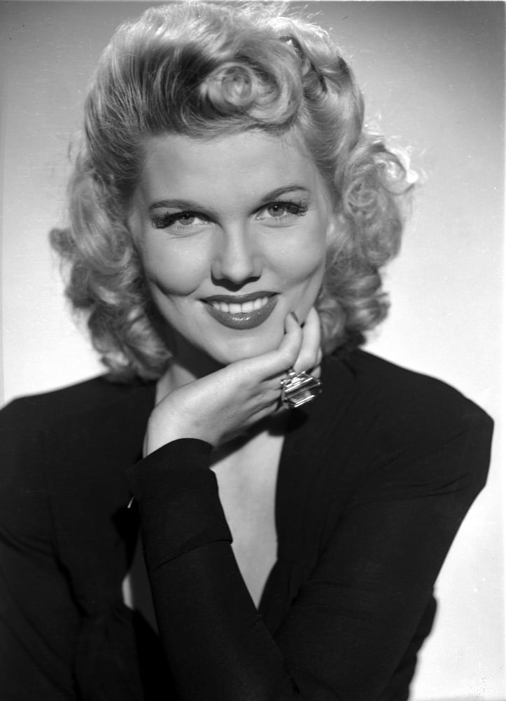 Joyce Mathews on a Long Sleeve Top and Chin on Hand Portrait Photo ...