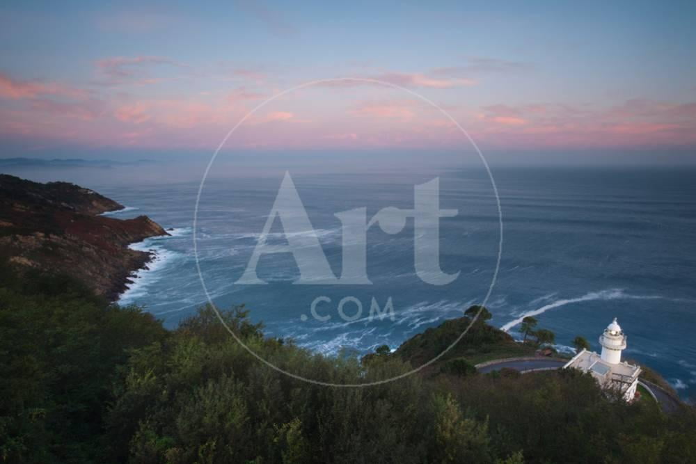Elevated view of Monte Igueldo lighthouse at dawn, San Sebastian ...
