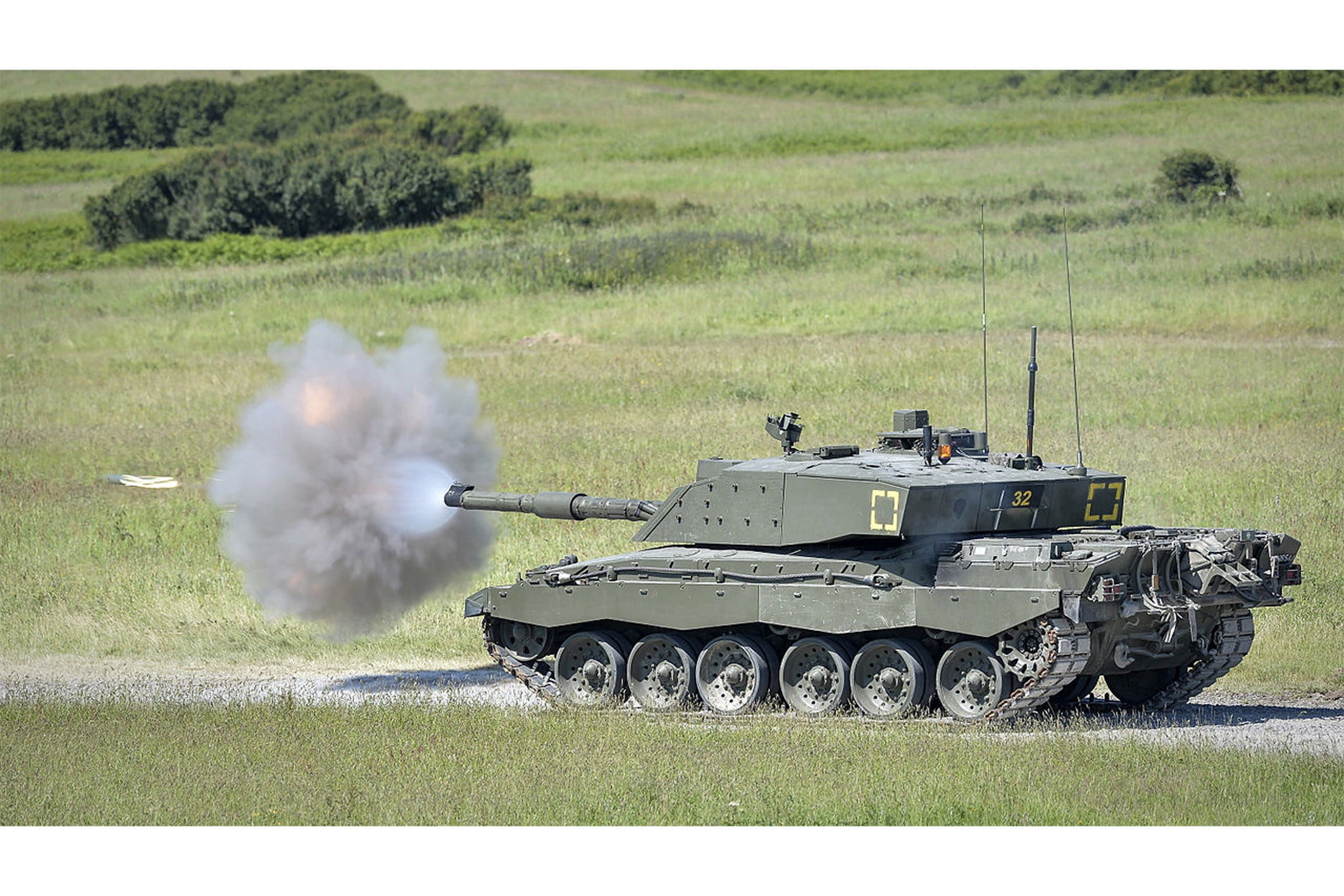 24x36 gallery poster, A Challenger 2 tank firing its main armament ...