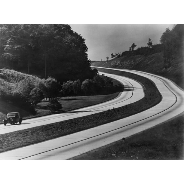 An Automobile On The Sweeping Curves Of The Autobahn With View Of The ...