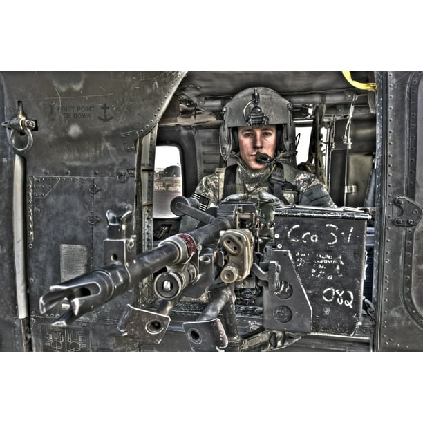 High dynamic range image of a UH-60 Black Hawk door gunner manning a ...