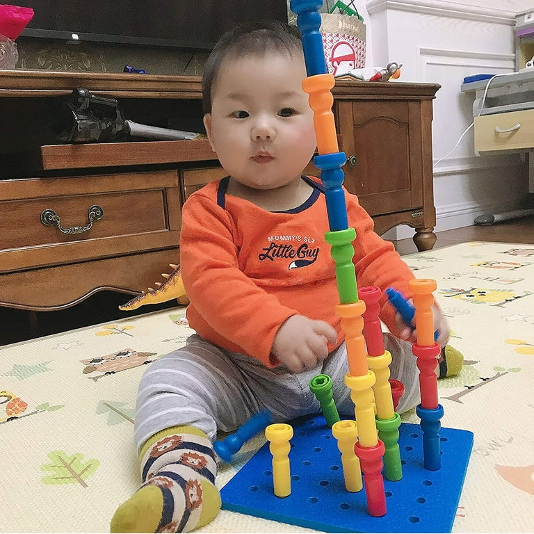 Toddlers Playing With Pegboard