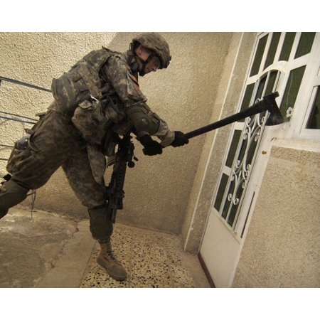 Us Soldier Breaks Down A Door During A House-To-House Search For ...