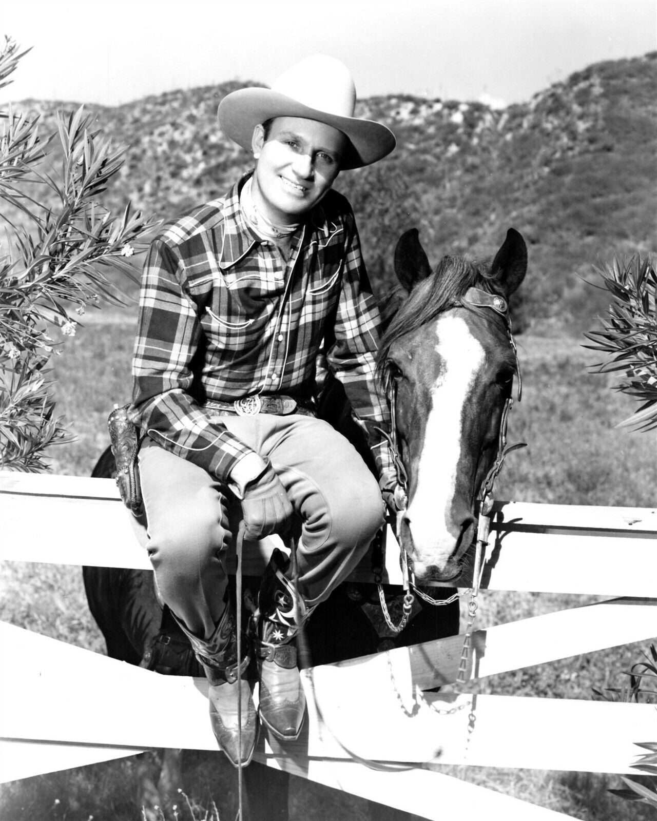 Gene Autry sits on fence with horse Champion at his side 8x10 inch ...