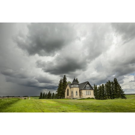 Church in a rural setting with storm clouds overhead; Winnipeg ...