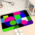 A brightly colored geometric patterned floor mat made of highly ...