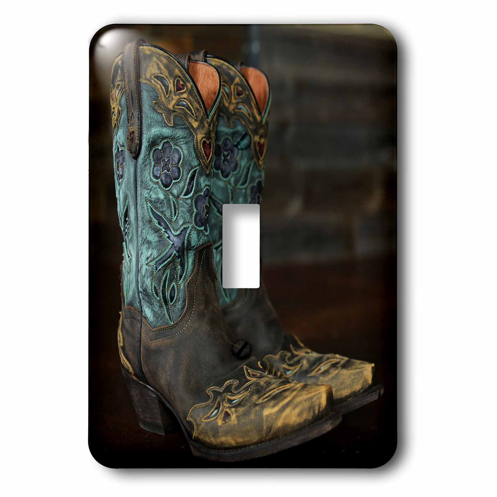 Photo of rustic cowgirl boots against a wood wall on a concrete floor ...
