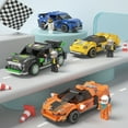 Four models of small particle building block racing cars are given as ...
