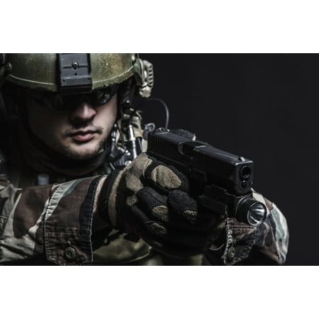 U.S. Marine Corps special operations command Marsoc raider with pistol ...