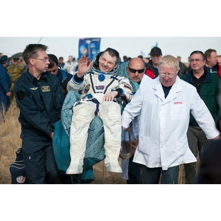 Cosmonaut Alexander Samokutyaev Carried After Returning From Over Five ...