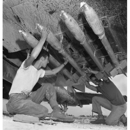 U.S. Marines Load Five-Inch Rockets Under The Wing Of A Corsair Fighter ...
