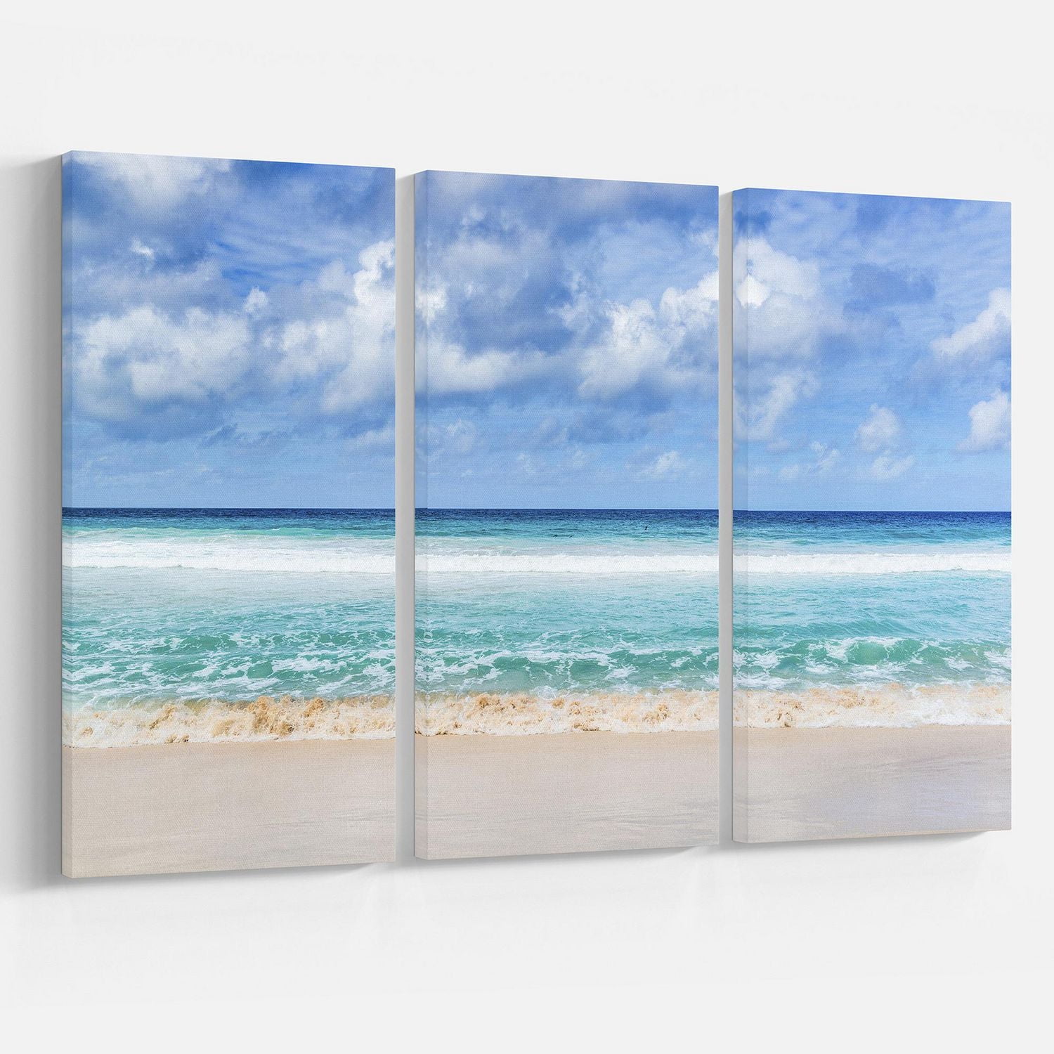 Click here for Designart Tranquil Beach Under White Clouds Canvas... prices