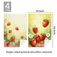 A red and white checkered table cloth with strawberries and daisieshand ...