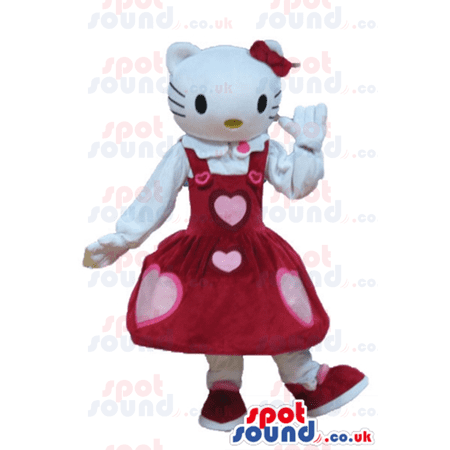 Hello kitty dressed in a long sleeveless red dress with pink hearts and ...