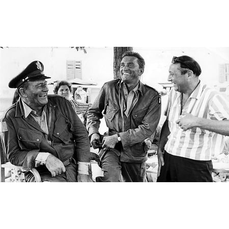John Wayne, Kirk Douglas, and Melville Shavelson on the set of Cast a ...