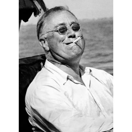President Franklin Roosevelt Smokes A Cigarette While Fishing For ...