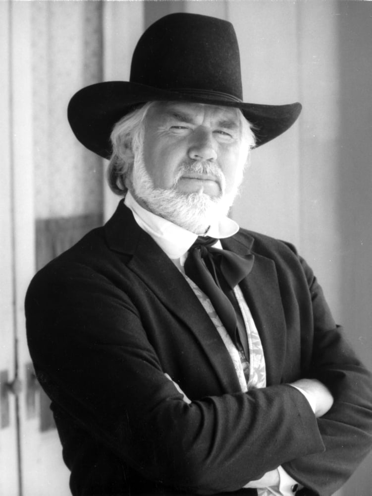 Kenny Rogers with his arms crossed wearing a cowboy hat Photo Print ...