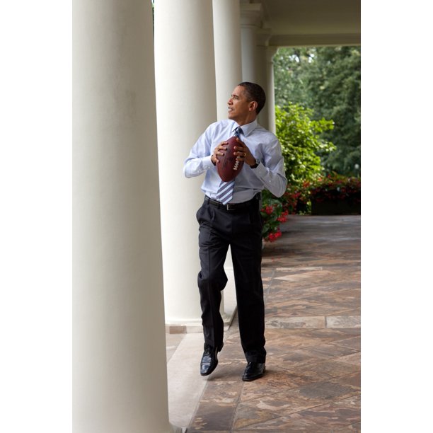 President Barack Obama Prepares To Throw A Football To Personal Aide ...
