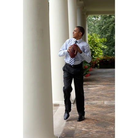 President Barack Obama Prepares To Throw A Football To Personal Aide ...