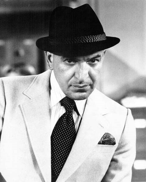 Telly Savalas looks dapper in light suit & black hat as Kojak 8x10 inch ...