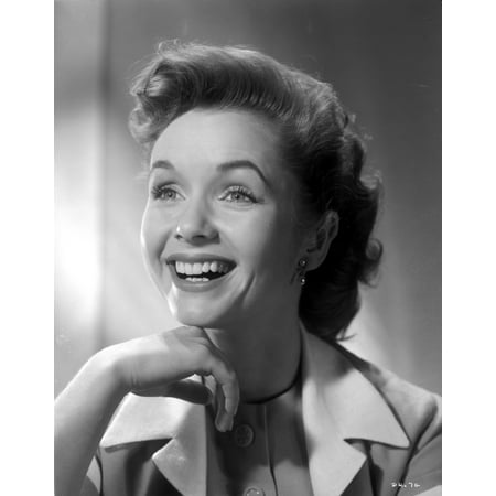 Debbie Reynolds smiling in Trench Coat with Hand on Her Chin Photo ...