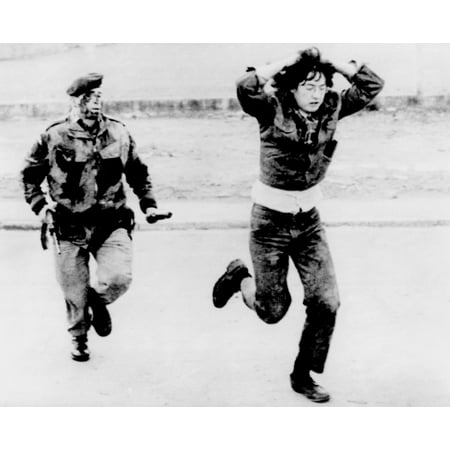 British Soldier Chasing A Demonstrator During A Riot In Londonderry ...