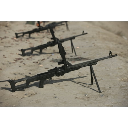 PK 7.62 mm general-purpose machine guns stand ready on a firing range ...