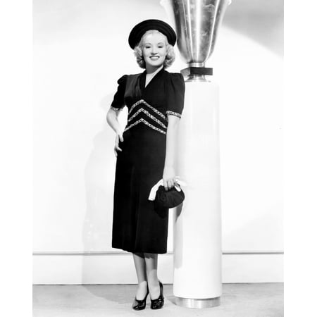 Betty Grable Modeling A Black Crepe Spring Frock Trimmed With White ...