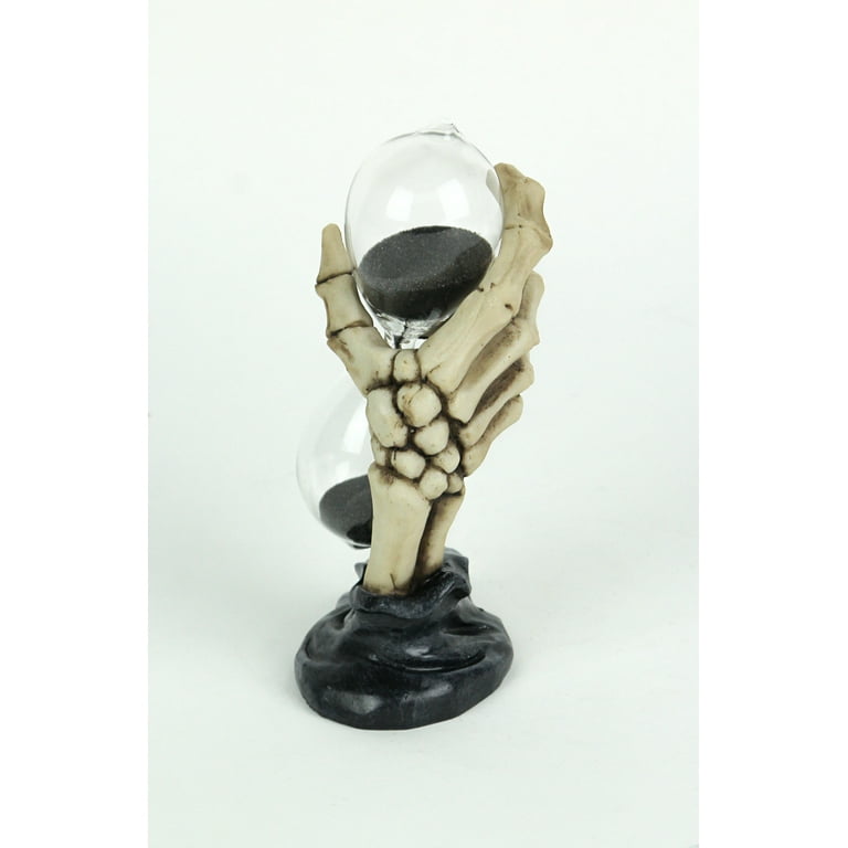 Skeleton Hand Holding Ball