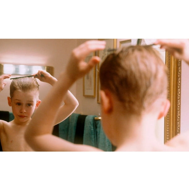 Macaulay Culkin in Home Alone combing hair in mirror 24x36 Poster ...