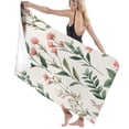 A soft microfiber beach towel with a stylish design featuring pink ...
