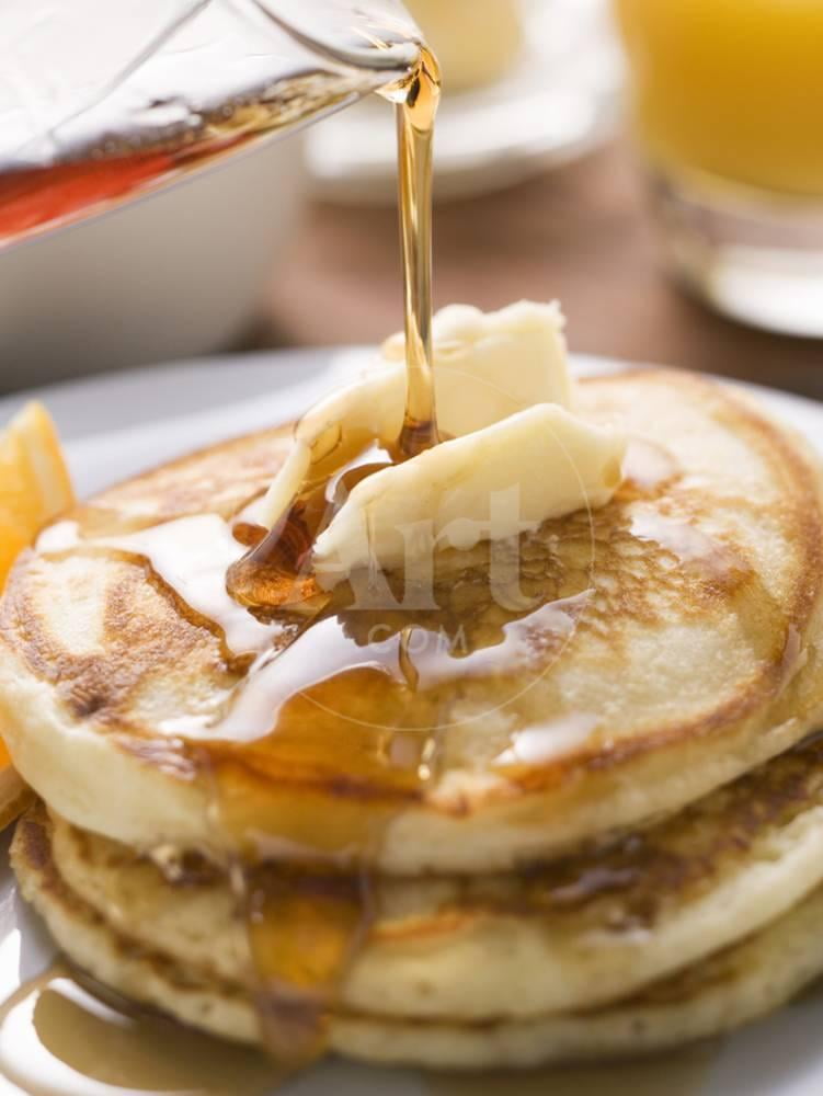 Pouring Maple Syrup over Pancakes with Dab of Butter, World Culture ...