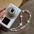 A Stylish Light Blue Floral Phone Case with a Chain, a CCD Camera Strap ...