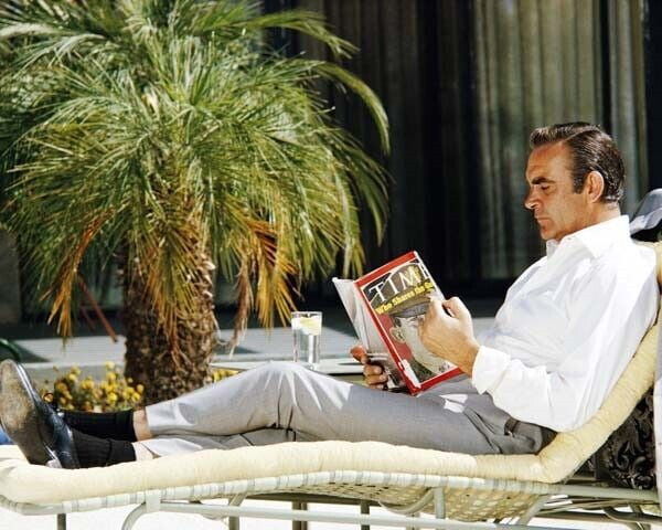 Sean Connery relaxes on Diamonds Are Forever set reading magazine 24x36 ...
