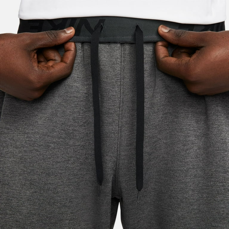 Nike Men's Therma-FIT Tapered Fitness Sweatpants in Grey Nike Men's Therma-FIT Tapered Fitness Sweatpants in Grey