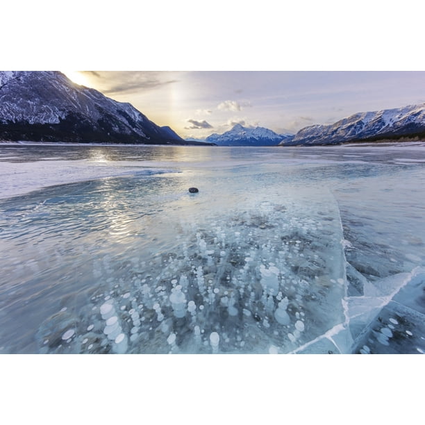 Methane ice bubbles under clear ice on Abraham Lake near Nordegg ...