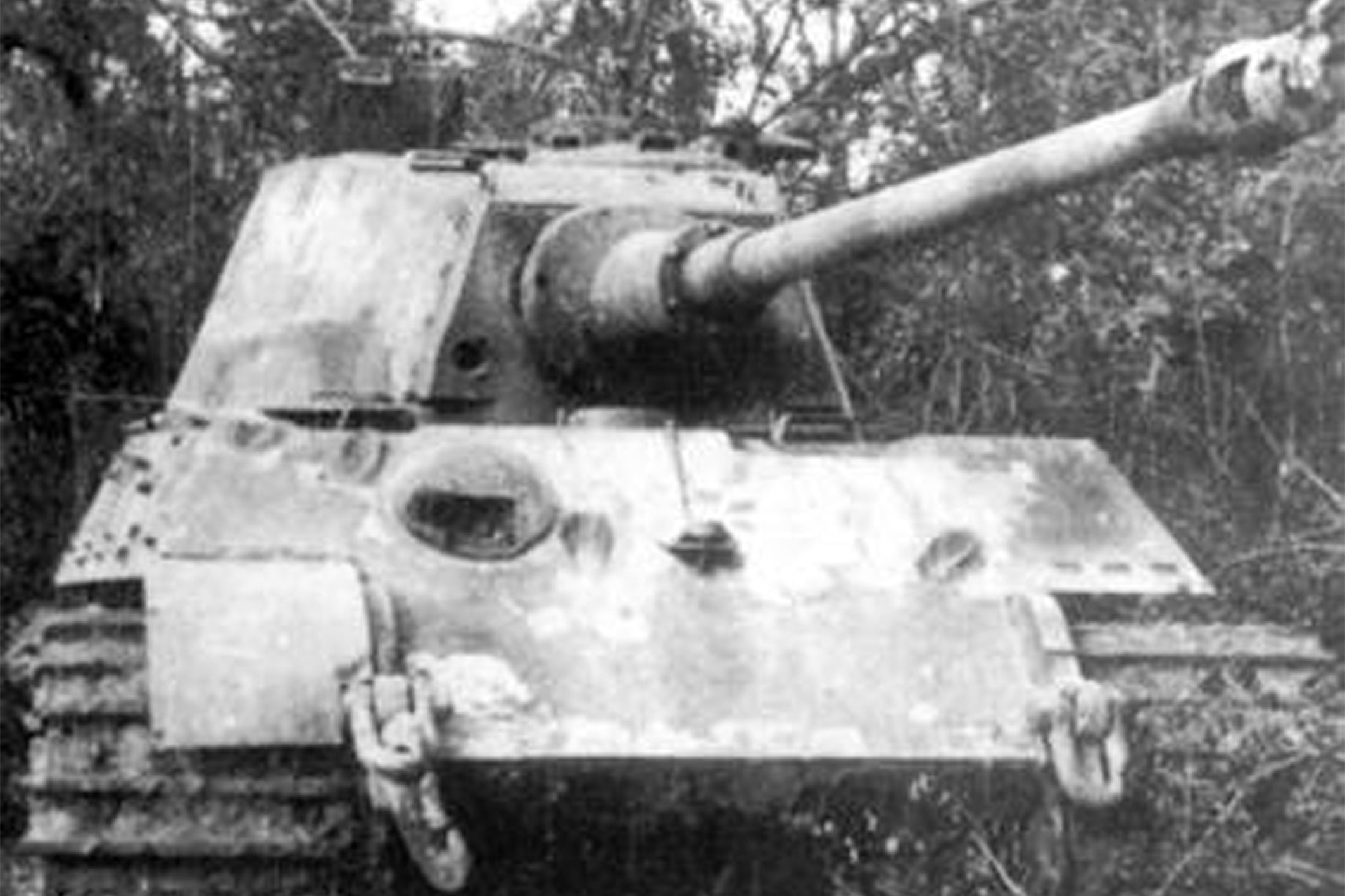 24x36 gallery poster, A Tiger II tank with fistsized dents in its front ...