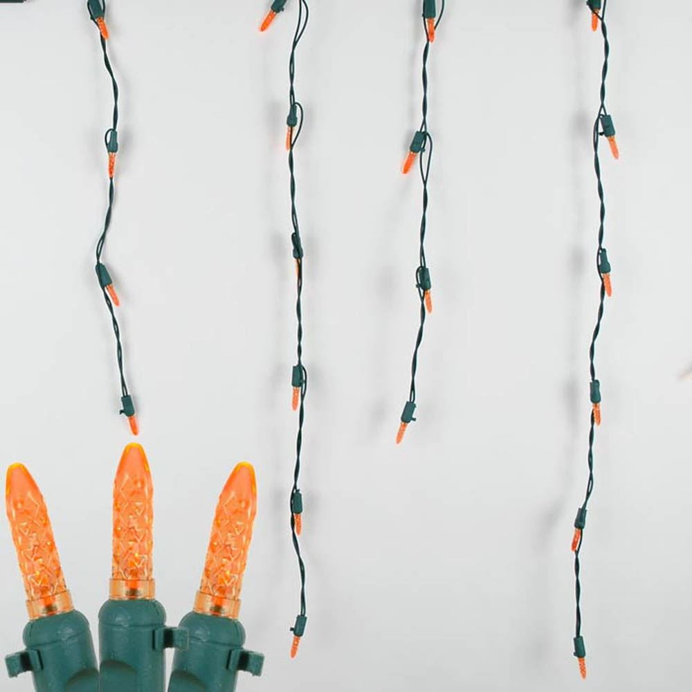 Novelty Lights M5 Christmas LED Icicle Light Set, Orange, Green Wire ...