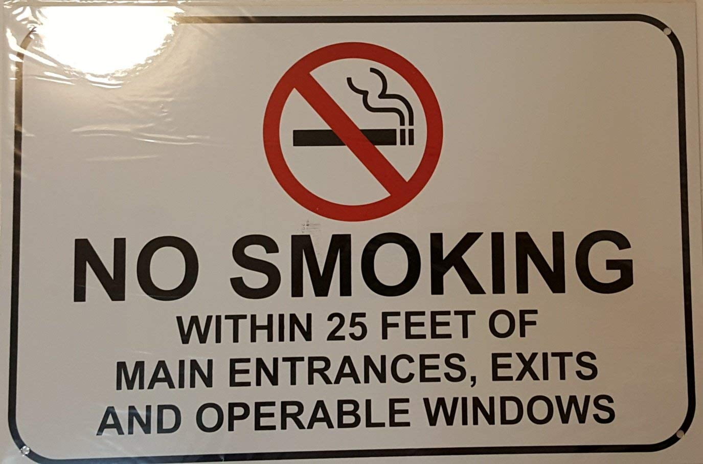 NO SMOKING WITHIN 25 FEET OF MAIN ENTRANCES, EXIT AND OPERABLE WINDOWS ...
