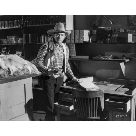 Film still featuring Tex Ritter in cowboy costume Photo Print (8 x 10 ...